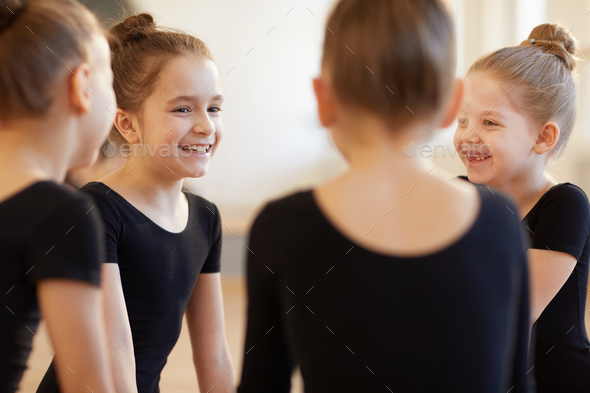 Girls Giggling in Dance Class Stock Photo by seventyfourimages | PhotoDune