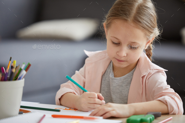 Diligent Little Girl Studying Stock Photo by seventyfourimages | PhotoDune