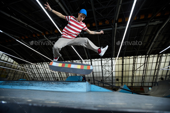 Jumping over skateboard Stock Photo by seventyfourimages | PhotoDune