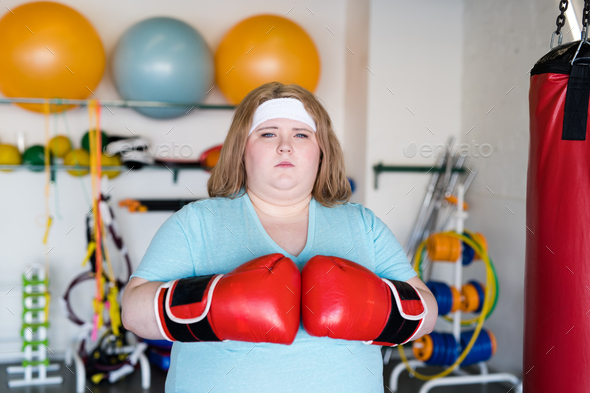 Overweight Woman Boxing in Gym Stock Photo by seventyfourimages | PhotoDune