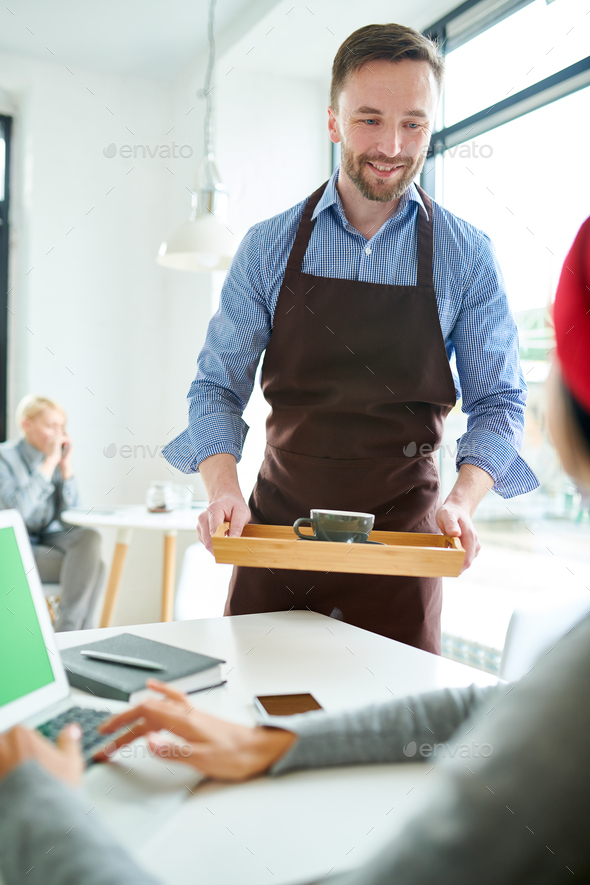 Handsome Waiter Serving Drinks Stock Photo by seventyfourimages | PhotoDune
