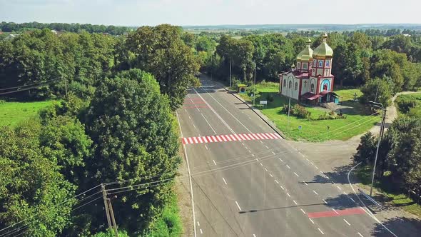 Aerial view of a new asphalt road. Flight over the highway surrounded ...