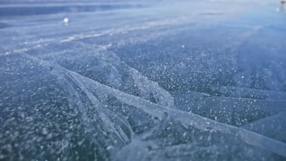 Snow Is Flying Over Surface of Ice. Snowflakes Fly on Ice of Lake ...