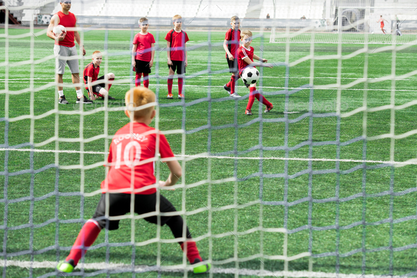 Teenage Boy Scoring Goal Stock Photo by seventyfourimages | PhotoDune