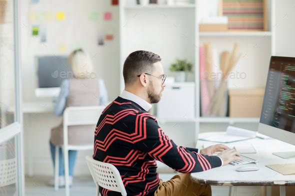 Concentrated on coding process Stock Photo by seventyfourimages | PhotoDune