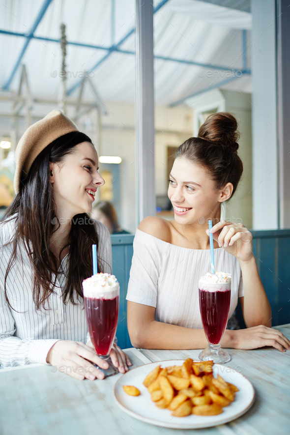 Girls in fast food cafe Stock Photo by Pressmaster | PhotoDune