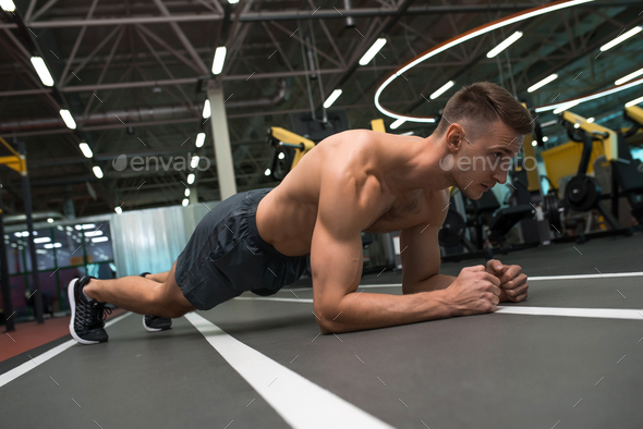 Straining Man Holding Plank Stock Photo by seventyfourimages | PhotoDune