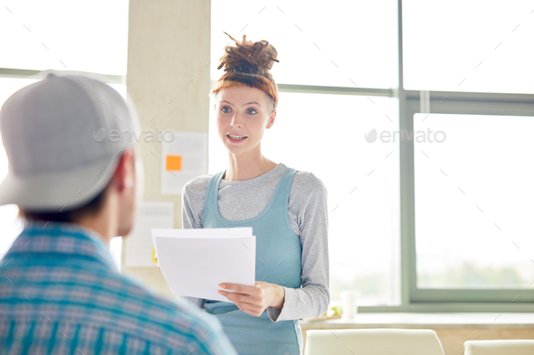 Confident student girl explaining project idea Stock Photo by Pressmaster