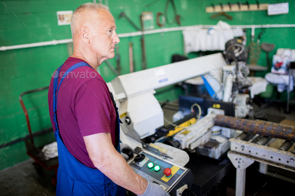 Operator standing at machine Stock Photo by Pressmaster | PhotoDune