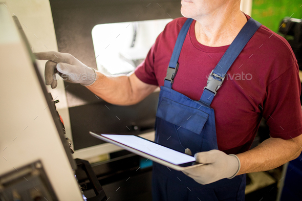 Engineer by control panel Stock Photo by Pressmaster | PhotoDune