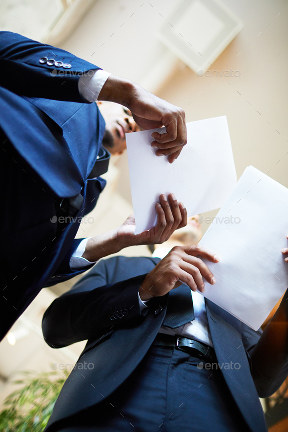 Office employees reading documents Stock Photo by Pressmaster | PhotoDune