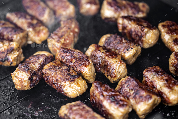 Grilled meat rolls called Mici or Mititei, traditional Romanian food ...