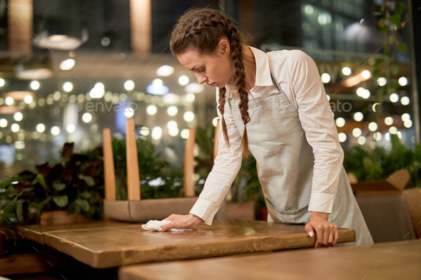 Wiping table Stock Photo by Pressmaster | PhotoDune