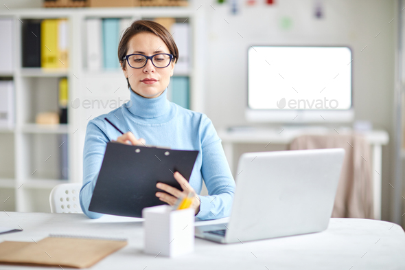 Secretary by workplace Stock Photo by Pressmaster | PhotoDune