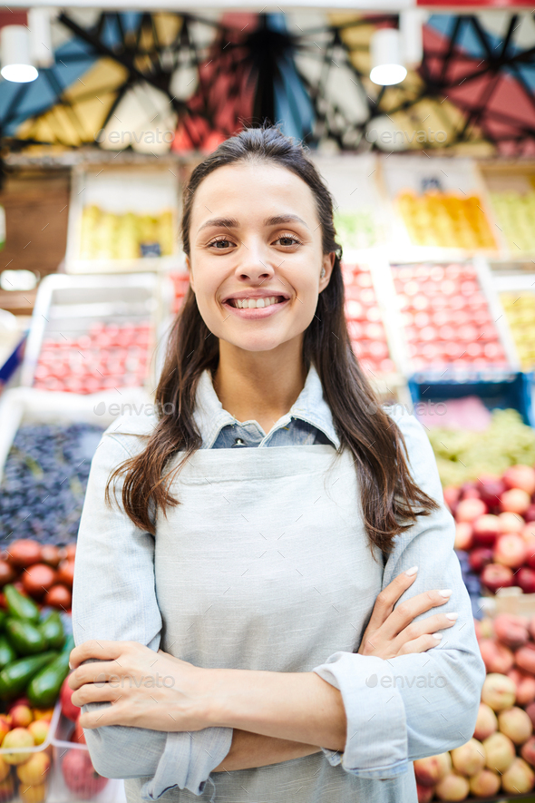 Positive grocer in apron Stock Photo by Pressmaster | PhotoDune