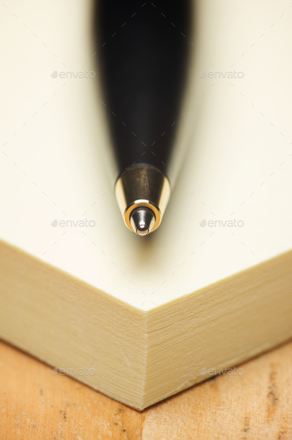 Pen and Post It Notes Pad Against a Wood Background Stock Photo by Andy ...