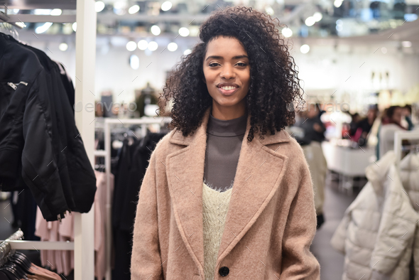 Black young woman doing shopping in a store Stock Photo by ...