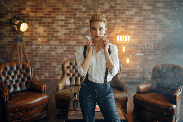Woman in strict clothes in studio, retro fashion Stock Photo by NomadSoul1