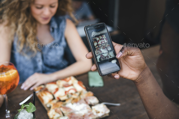 mixed race couple together in a restaurant Stock Photo by jpozzi ...