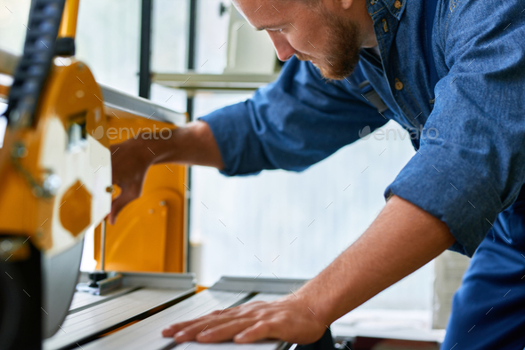 Factory Worker Using Machines Stock Photo by seventyfourimages | PhotoDune