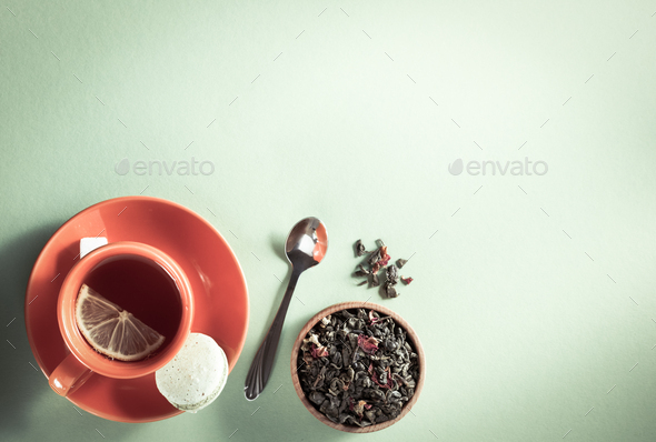 cup of tea at light green paper Stock Photo by seregam | PhotoDune