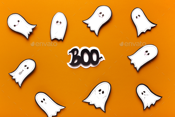 Spooktacular Halloween ghosts flying on orange background Stock Photo ...