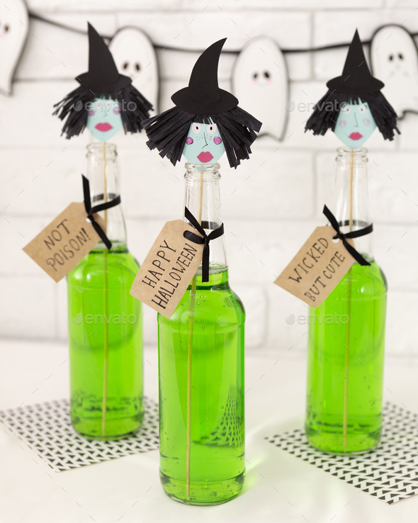 Green toxic cocktail with paper heads on white Stock Photo by Prostock ...