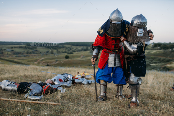 Wounded medieval knights after great battle Stock Photo by NomadSoul1