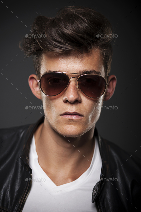 Portrait of male model wearing sunglasses Stock Photo by gpointstudio