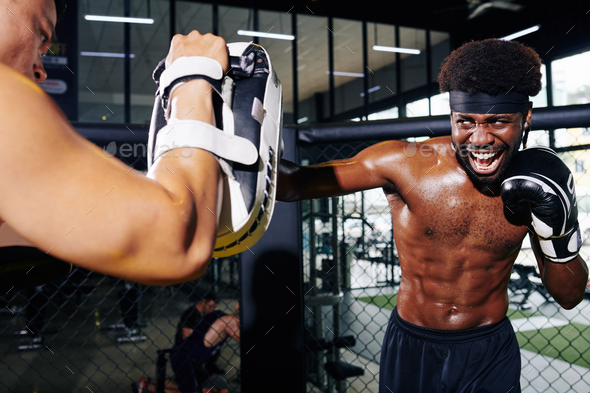 Boxer training with coach Stock Photo by DragonImages | PhotoDune
