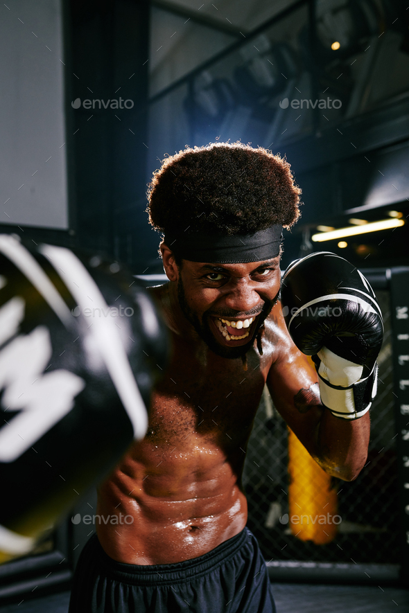 Excited shirtless Muay Thai boxer Stock Photo by DragonImages | PhotoDune