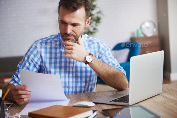 Business person reading important documents at his desk Stock Photo by ...