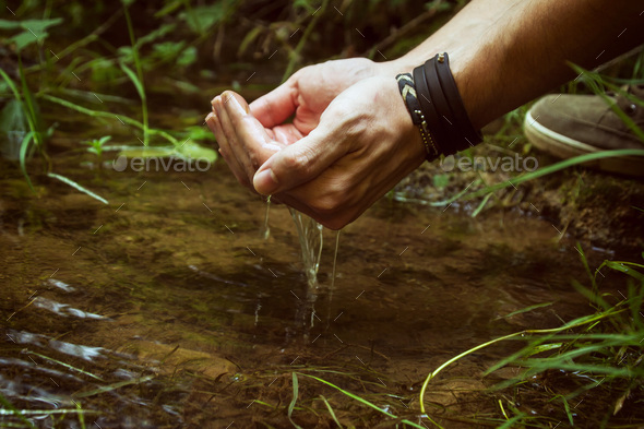 Man hand touching the cold water of a pond Stock Photo by nanihta ...