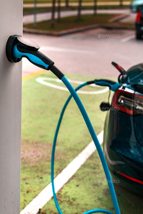 Electric vehicle charging station point Stock Photo by stevanovicigor
