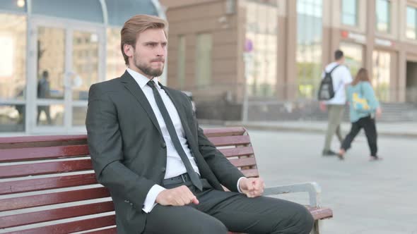 Tense Businessman Feeling Frustrated While Sitting Outdoor on Bench ...
