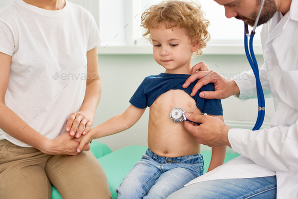 Cute Little Boy at Medical Check Up Stock Photo by seventyfourimages