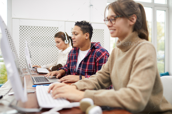 Row of Students in Computer Class Stock Photo by seventyfourimages