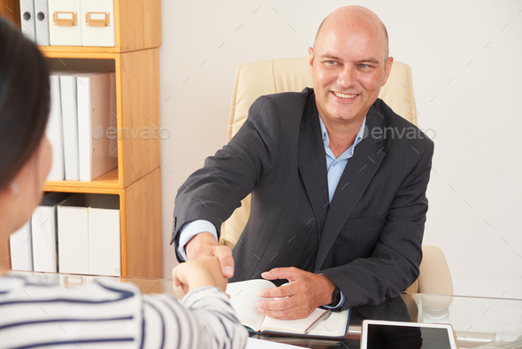 Insurance agent with client Stock Photo by DragonImages | PhotoDune