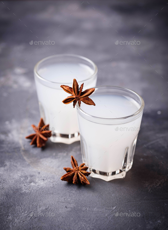 Traditional Greek ouzo, alcohol drink with anise Stock Photo by furmanphoto