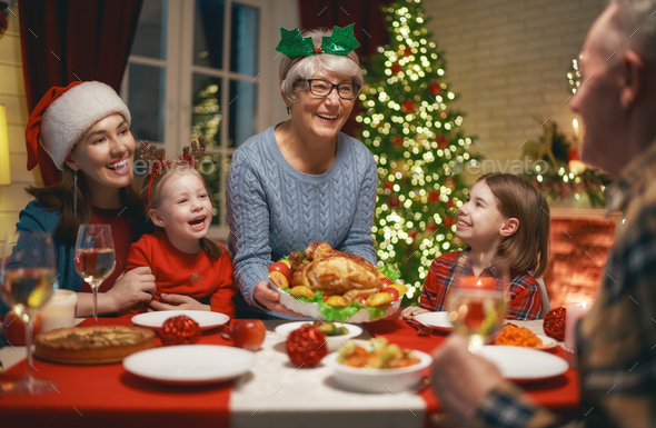 family celebrating Christmas Stock Photo by choreograph | PhotoDune