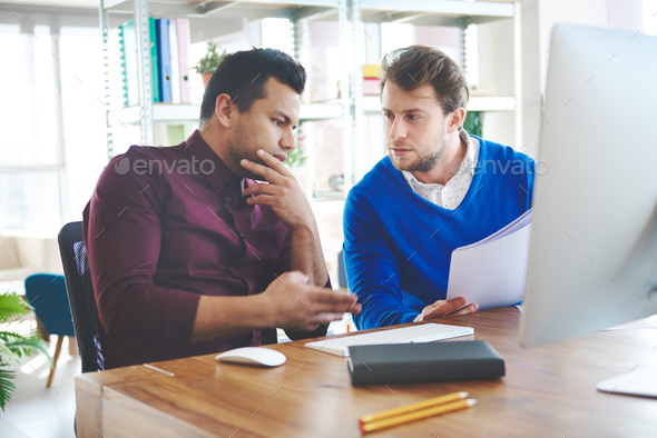 Man looking at magazine together Stock Photo by gpointstudio | PhotoDune