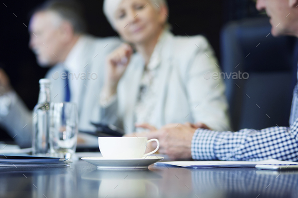 Cup of coffee on the conference table Stock Photo by gpointstudio ...