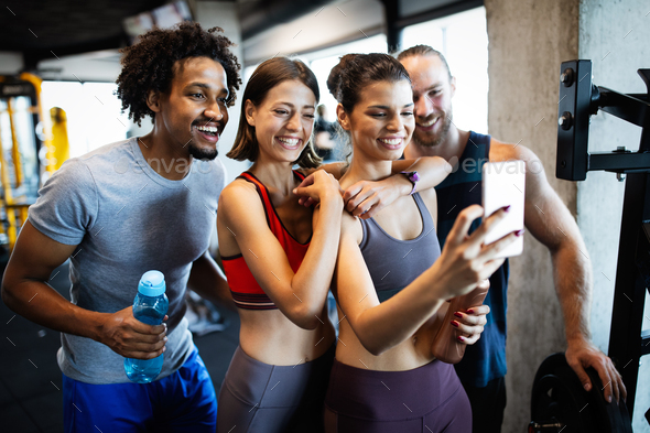 Group of friends having fun at the gym, making a selfie Stock Photo by ...