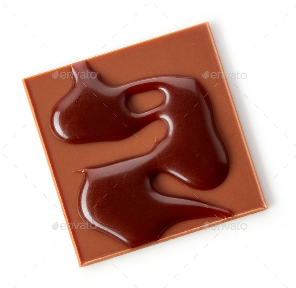 chocolate square decorated with melted chocolate Stock Photo by magone