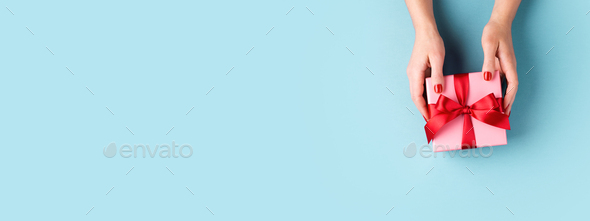 Banner with Woman's Hands Holding Gift Box on Blue Background. Stock ...