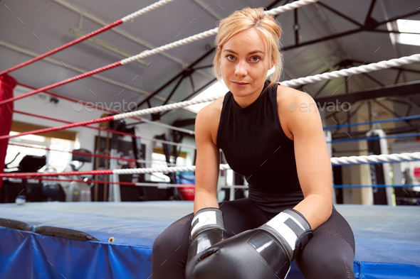 Portrait Of Female Boxer With Gum Shield In Gym Wearing Boxing Gloves ...