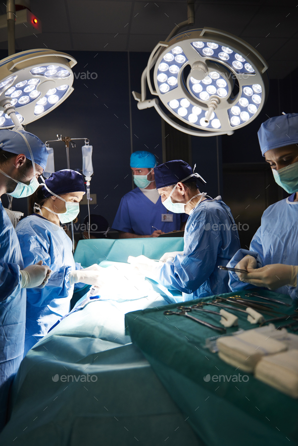 Dark operating room and surgeons Stock Photo by gpointstudio | PhotoDune