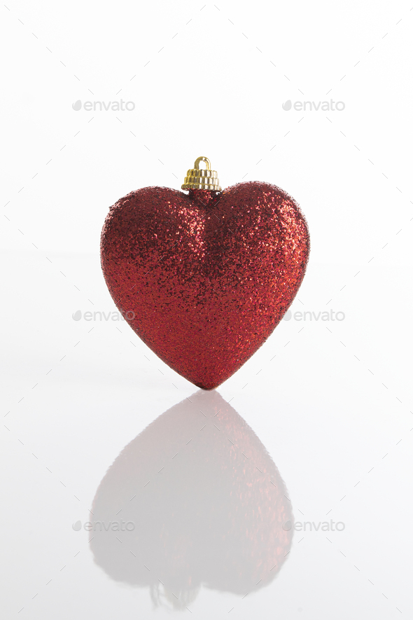 Red Christmas decoration with a heart shape Stock Photo by Nick_Paschalis