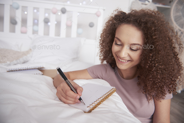 Beautiful teenage girl writing diary Stock Photo by gpointstudio ...