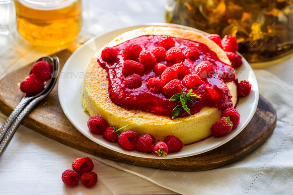Cheesecake with raspberry sauce Stock Photo by karaidel | PhotoDune